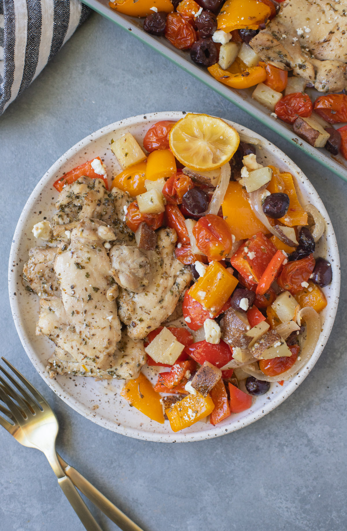 Greek Chicken Thighs Recipe (Sheet Pan) - The Clean Eating Couple
